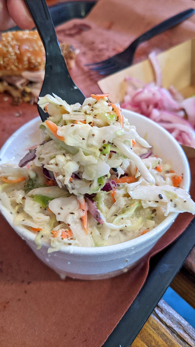 This isn't just coleslaw; it's the perfect acidic counterpoint to barbecue richness &ndash; crisp, bright, and studded with seeds for unexpected texture.