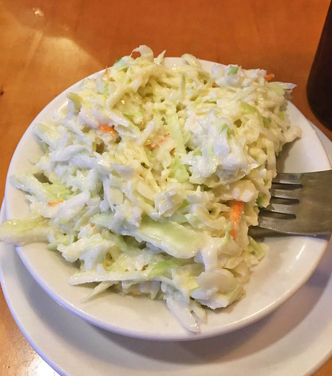 Coleslaw that actually tastes like vegetables instead of mayonnaise soup. The perfect tangy counterpoint to all that comfort food.