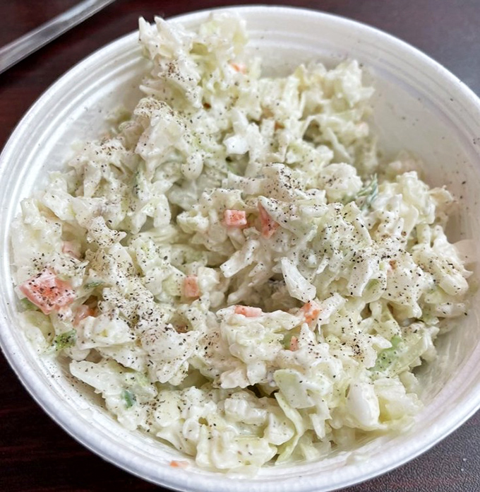 That coleslaw isn't just a side dish &ndash; it's the crisp, tangy referee your fried fish needs.