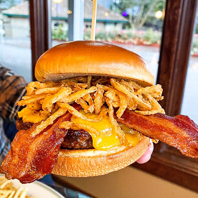 This isn't just a burger&mdash;it's architecture. Melty cheese cascading over bacon with crispy onion straws playing structural support.