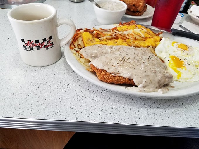 Country fried steak smothered in pepper gravy with eggs and hashbrowns &ndash; the breakfast equivalent of a warm hug from your favorite aunt.