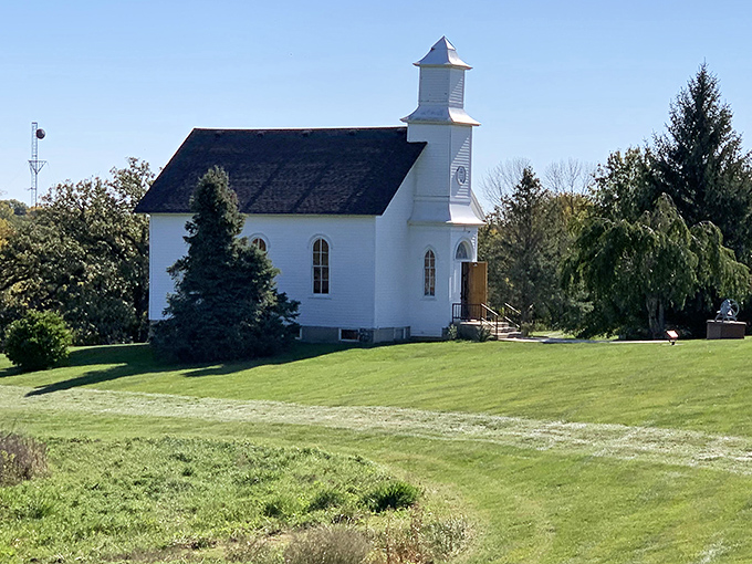 This pristine white country church stands as a reminder that in small-town Iowa, Sunday gatherings are still a cornerstone of community life.