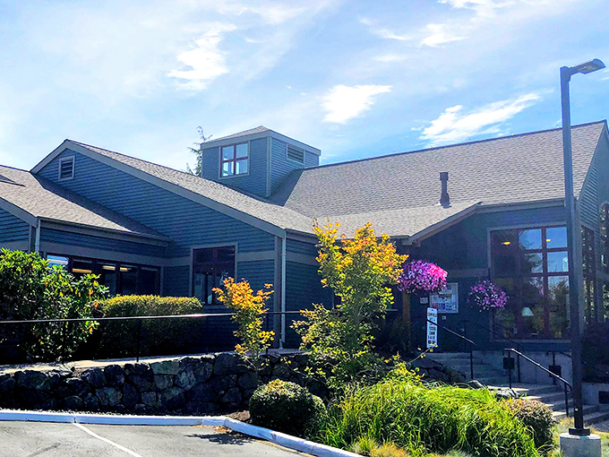 The blue-hued building with its welcoming entrance and vibrant landscaping isn't just a library &ndash; it's Coupeville's living room where stories are shared and discovered.
