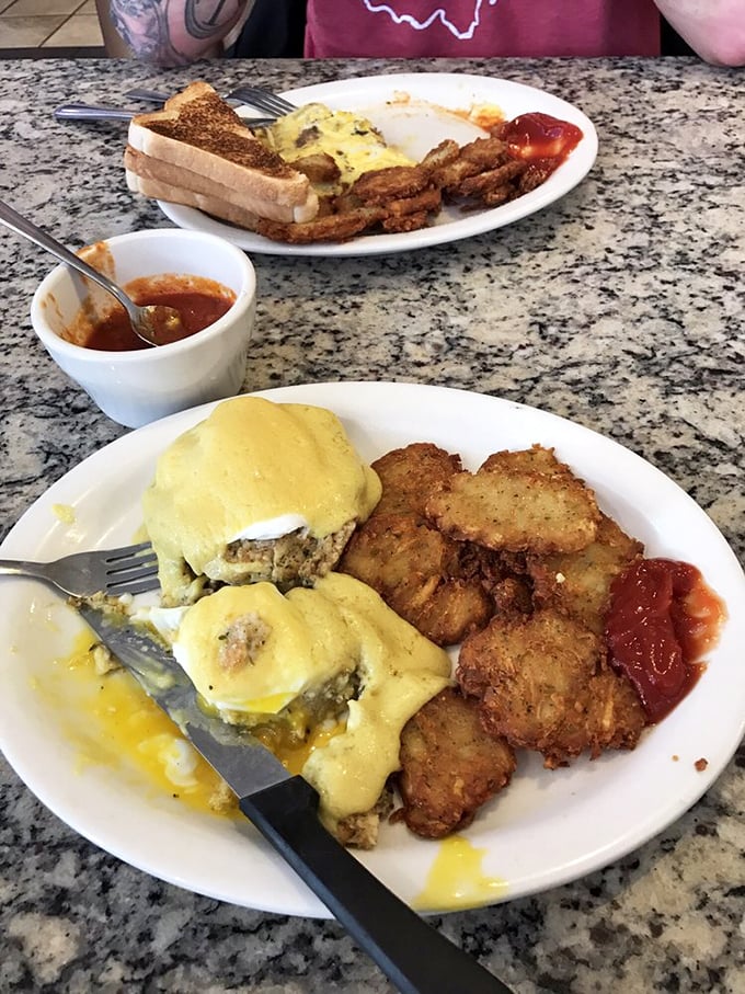 Eggs Benedict elevated with crab&mdash;a morning masterpiece where hollandaise cascades over seafood like a sunrise over the Susquehanna.