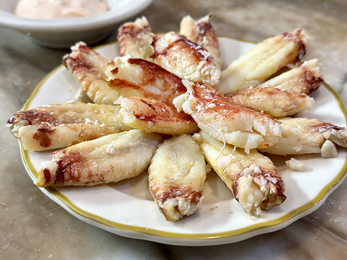 Crab legs arranged like nature's perfect fan &ndash; sweet, tender meat that makes you wonder why we bother cooking anything else in this world.