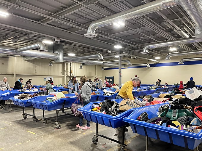 Shoppers navigate the bins with the focus of archaeologists discovering a new civilization of deals.