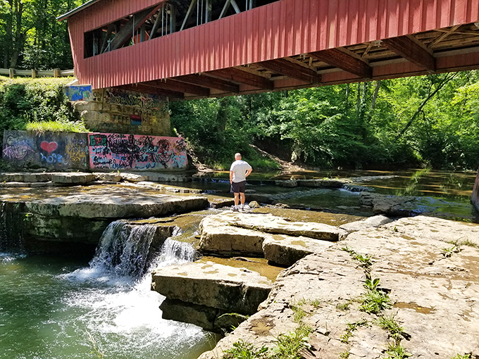 The perfect spot for contemplation: where rushing water below meets solid craftsmanship above.