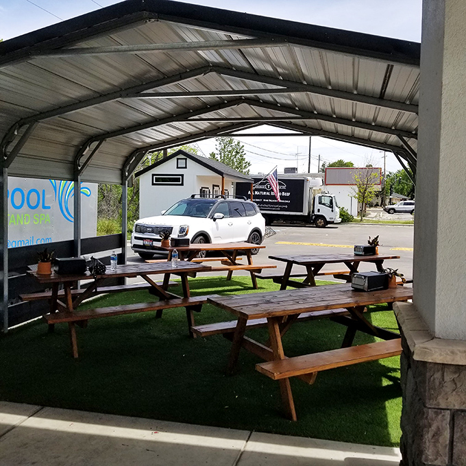 Al fresco dining, BBQ-style. These picnic tables have witnessed more food euphoria than a cooking show judge's facial expressions.
