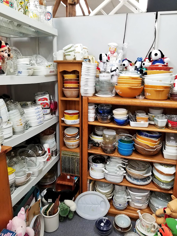 Pyrex paradise! A collector's dream of vintage bowls and dishes stacked like a colorful timeline of American kitchen history.