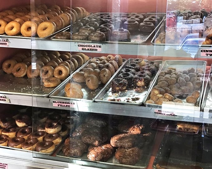 Donut display cases that make adults press their noses against the glass like kids. Resistance is futile, calories be damned.