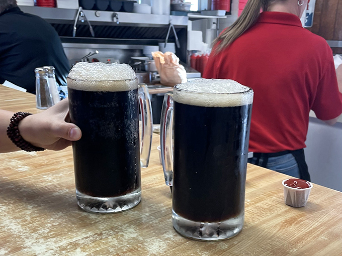 Two frosty mugs of draft root beer with perfect foam caps&mdash;like Guinness for the under-21 crowd, but with universal appeal.