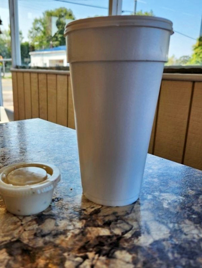 Coffee in a simple white cup &ndash; because when your biscuits are this good, the coffee knows to play a supporting role.