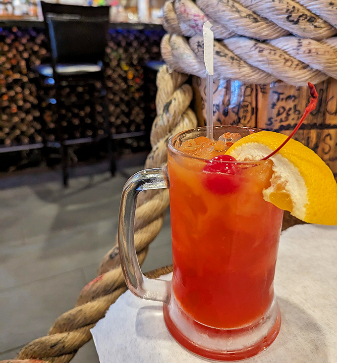 A tropical cocktail that says, "Yes, you deserve this fruity vacation in a glass after wrestling with all those crab legs."