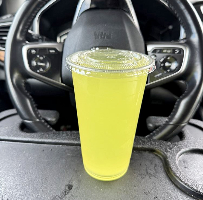 That neon yellow drink isn't just refreshing&mdash;it's practically radiating happiness from the cup holder of someone's very lucky day.
