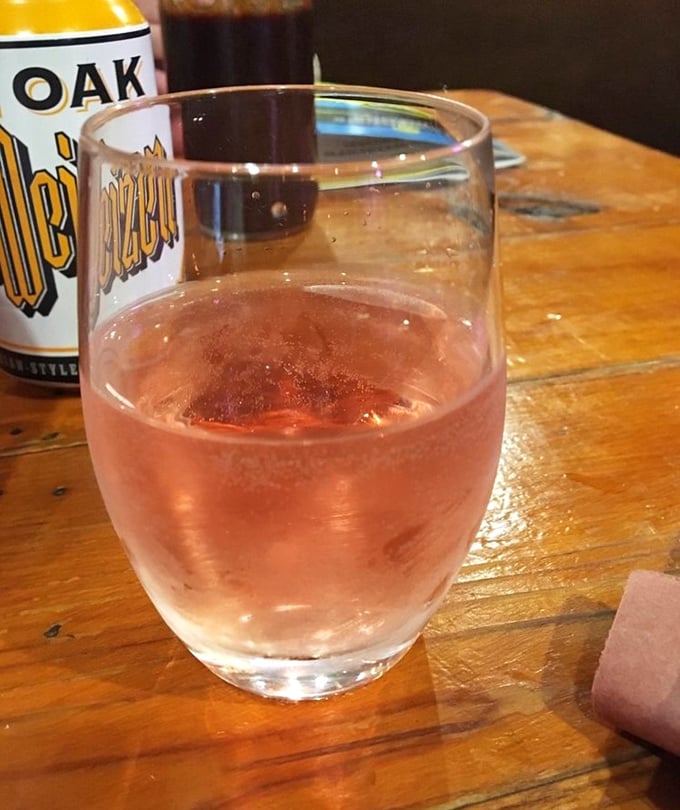 A cold beverage in hand&mdash;the essential companion to offset hours of meat consumption and provide the courage to order seconds.