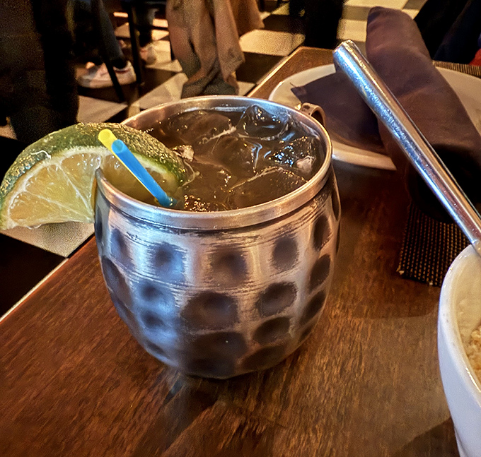This Moscow Mule isn't just a drink, it's a shiny copper conversation starter that keeps you company between bites of pasta paradise.