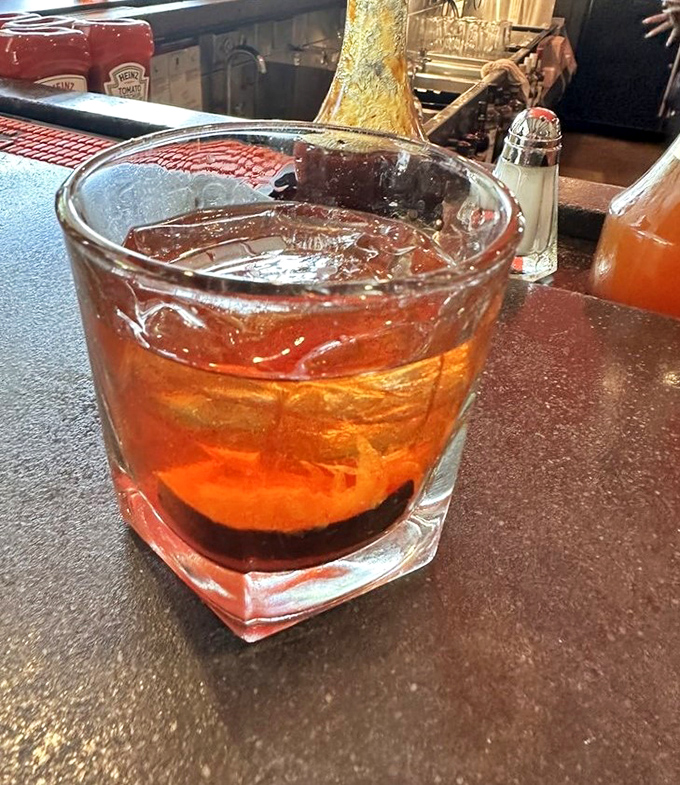 That bourbon glow matches the warmth you'll feel after conquering a full rack of ribs here.