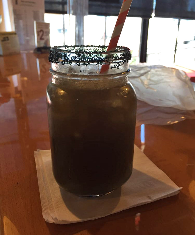 Sweet tea in a mason jar with a blackened sugar rim&mdash;because sometimes your beverage deserves as much attention as your main course.
