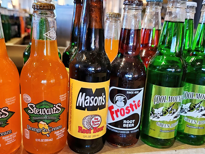 The soda selection rivals a candy store, with vintage bottles of liquid nostalgia that taste like childhood memories with a fizzy kick.