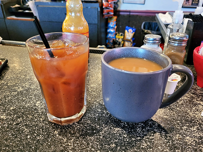 Coffee in a blue mug and iced tea – the dynamic duo of morning beverages ready to jumpstart your day.