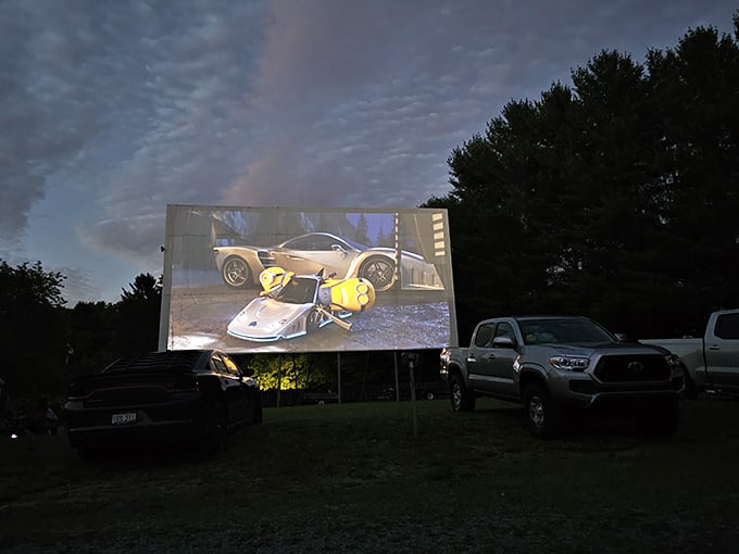 As twilight fades, the screen comes alive with high-octane action. Modern digital projection meets classic outdoor viewing for the perfect evening escape.