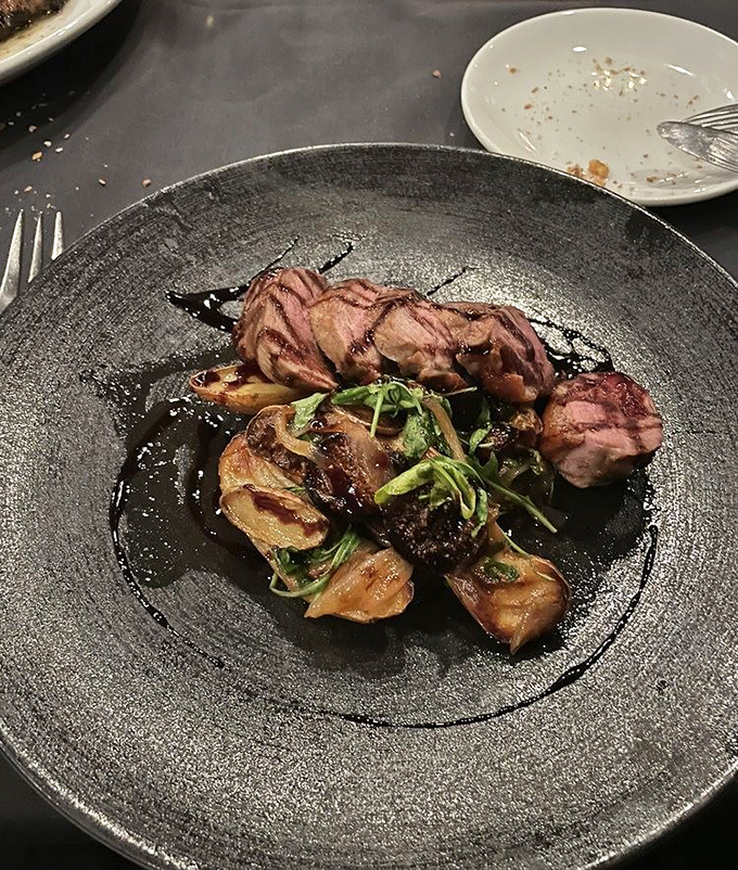 Duck breast cooked to that magical sweet spot between tender and caramelized, paired with potatoes that clearly went to finishing school.