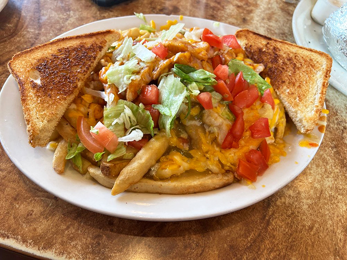 Loaded fries that laugh in the face of diet plans&mdash;a mountain of potatoes topped with enough cheese, meat, and veggies to make a nutritionist weep and your taste buds sing.