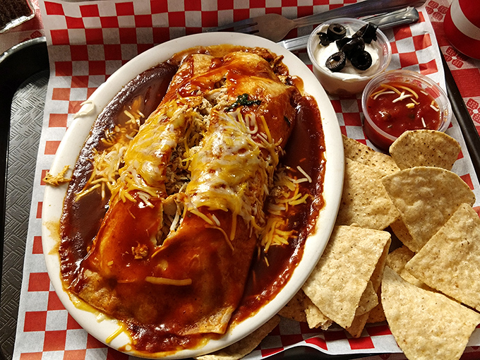 These enchiladas swim in a sea of rich sauce and melted cheese, flanked by tortilla chips standing ready for the inevitable sauce-scooping mission.