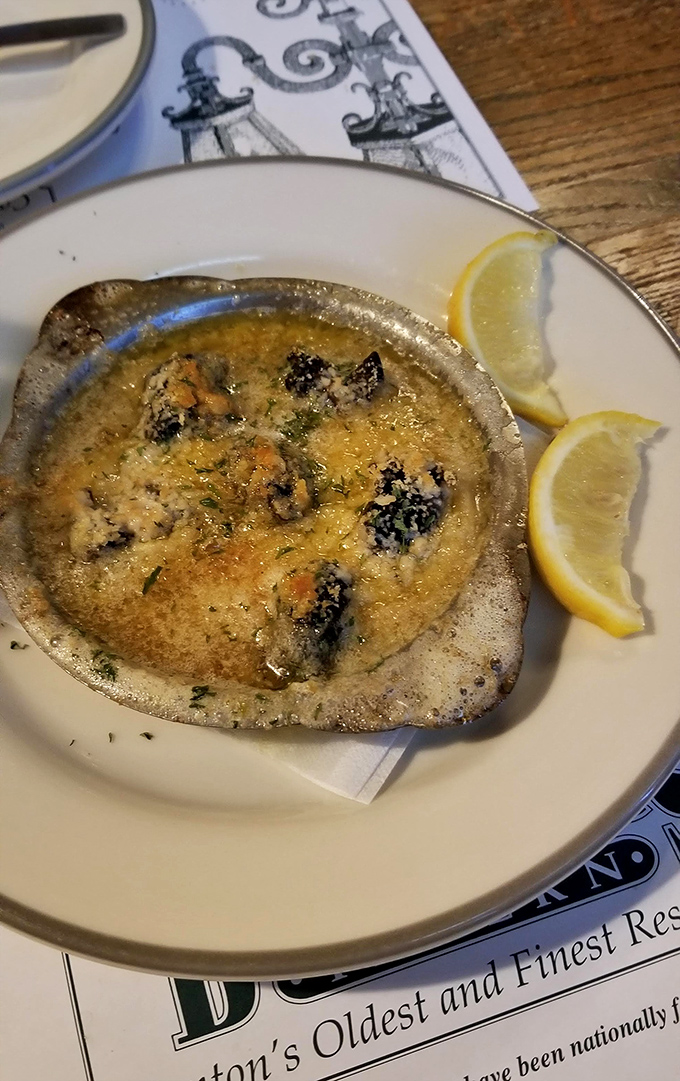 Escargot swimming in garlicky, herbed butter with lemon wedges standing by &ndash; a dish that turns the curious into converts with just one bite.