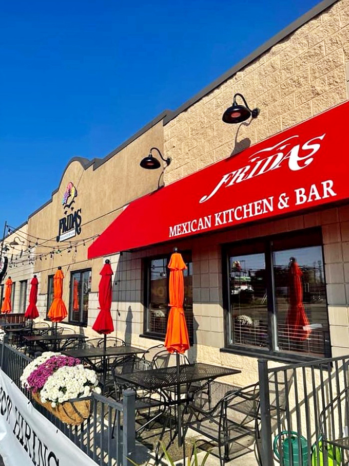 Frida's vibrant patio umbrellas pop against the blue sky, promising margaritas and Mexican flavors that would make a siesta absolutely necessary afterward.