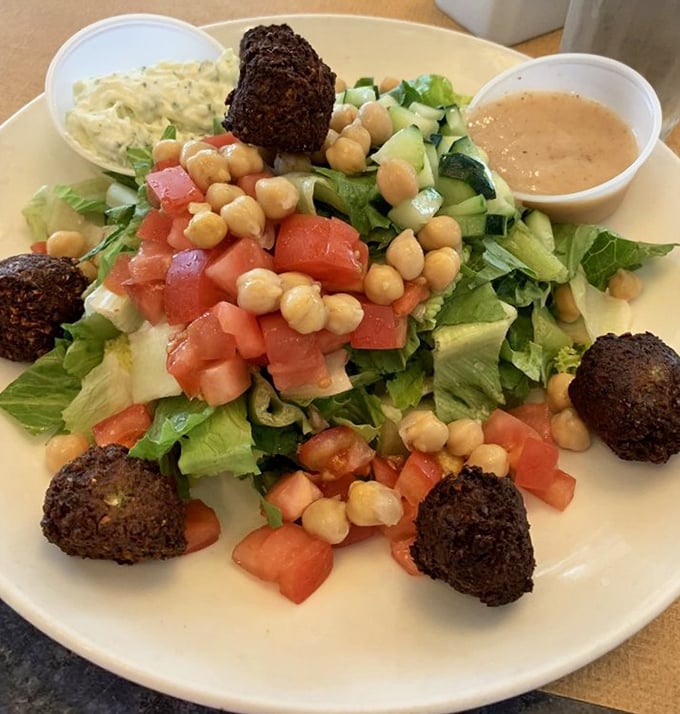 A falafel salad that brings the Mediterranean to Long Island—crispy chickpea spheres holding court over a vibrant kingdom of fresh vegetables.