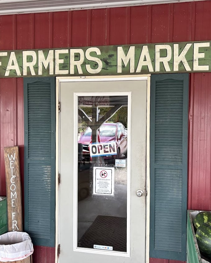 That classic red barn siding and weathered "Farmers Market" sign promise authentic country treasures within&mdash;no big-box homogeneity here!