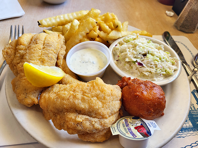 A plate that answers the eternal question: "What does happiness look like?" Turns out, it's fried fish with a hush puppy sidekick.