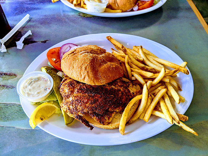 This fish sandwich isn't messing around—it's the heavyweight champion of lunch, with crispy fries as worthy cornermen.