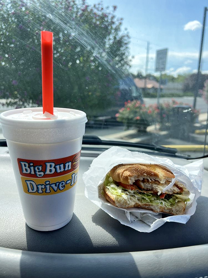 Car dining perfection: one hand on the wheel, one hand on your sandwich. It's the ultimate multitasking for those who understand life's true priorities.