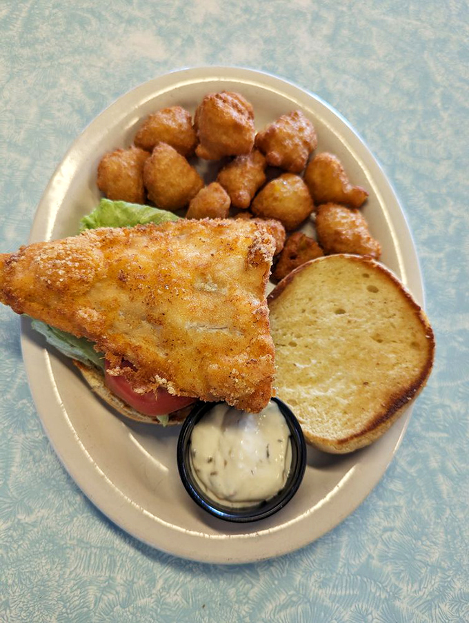 This isn't just a fish sandwich &ndash; it's a golden-fried masterpiece with a side of perfectly crispy tater tots that would make any lunch break memorable.