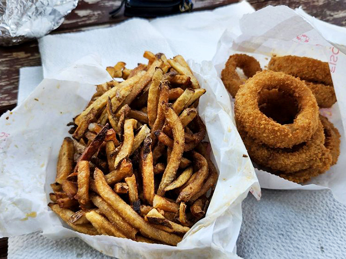 Crispy on the outside, fluffy within&mdash;these hand-cut fries and golden onion rings aren't just sides, they're co-stars in your lunch performance.