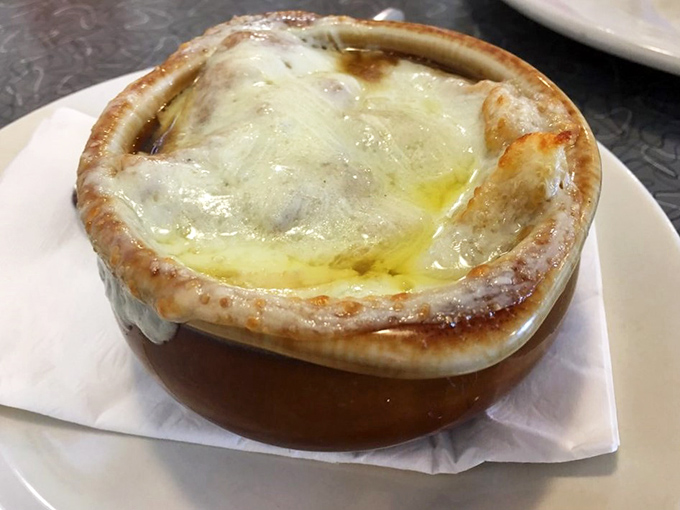 French onion soup with a cheese cap so perfect it deserves its own zip code. The ultimate comfort in a crock.