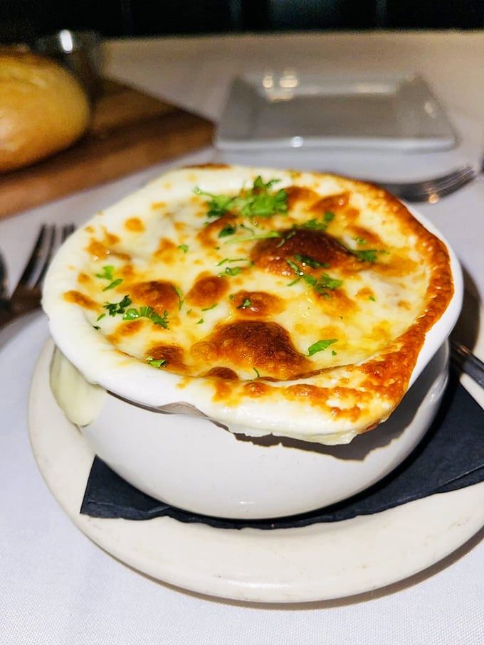 This isn't just soup&mdash;it's French onion magic with a golden crown of bubbling cheese that deserves its own coronation ceremony.