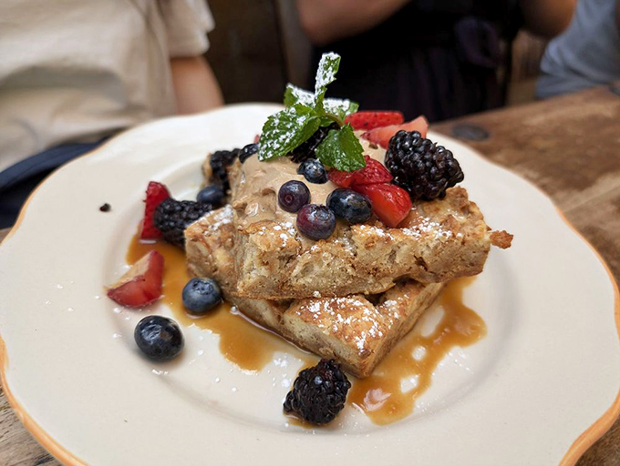 French toast piled with fresh berries and dusted with powdered sugar makes breakfast the most important meal for good reason.