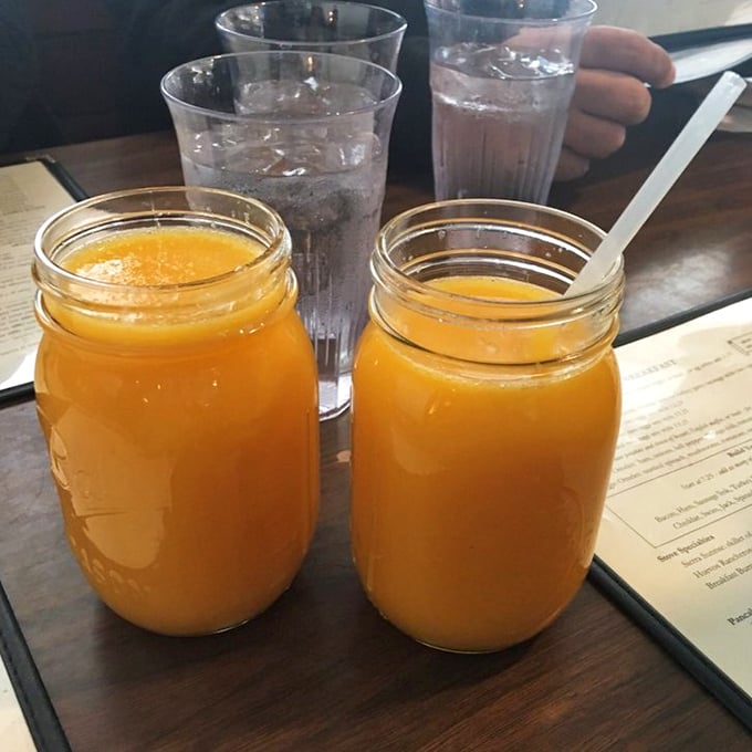 Fresh-squeezed orange juice served in Mason jars&mdash;because when you're doing things right, even the container needs to telegraph "this isn't from concentrate, friend."