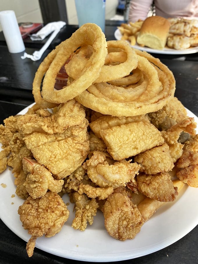 Fried seafood piled high with those signature onion rings&mdash;a tower of crispy goodness that makes you want to build a shrine to the fryer.