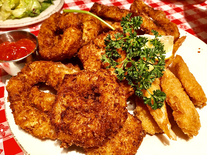 Crispy, golden-brown treasures from the deep fryer's magic. The onion rings and fried shrimp duo that makes you question why you ever bothered with salad.