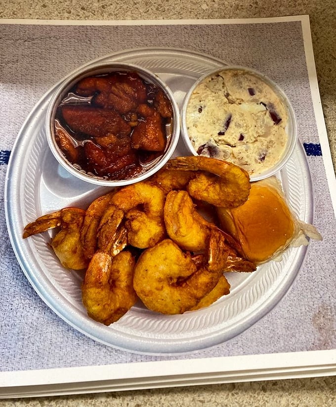 Fried shrimp and crab cake sharing a container like old friends at a reunion&mdash;golden, crispy, and ready for their close-up.