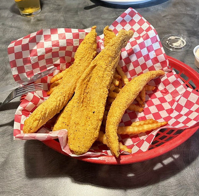 Cornmeal-crusted catfish that's practically Missouri's unofficial state treasure. Paired with those fries, it's the comfort food equivalent of a warm hug.