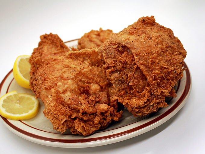 Fried chicken that would make Colonel Sanders weep with jealousy. That crust has more layers than your favorite drama series.