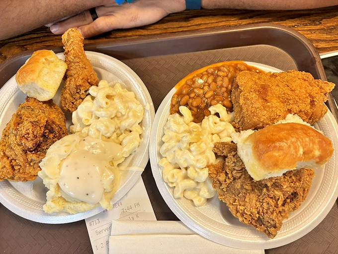 Southern comfort arranged on a plate&mdash;crispy chicken, creamy mac and cheese, and mashed potatoes that could solve world peace if given the chance.