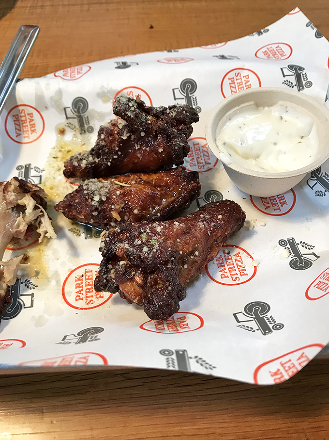 These wings aren't just good&mdash;they're "text your friends immediately" good, with a garlic parmesan coating that should be illegal in several states.