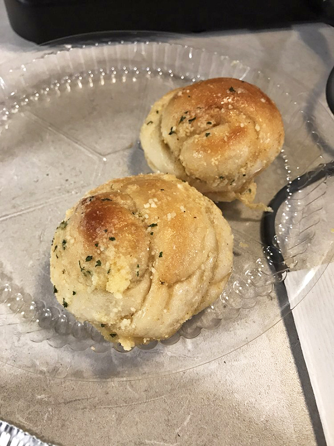 Golden garlic knots that look like edible clouds dusted with herbs &ndash; resistance is absolutely futile here.