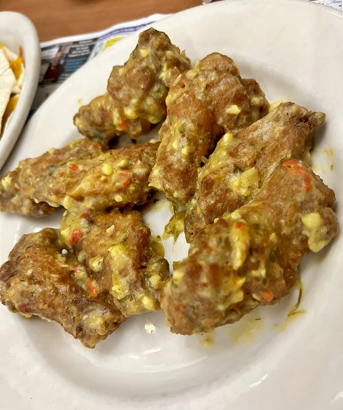 These garlic parmesan wings aren't just appetizers &ndash; they're conversation stoppers that demand your full attention and possibly an extra napkin.